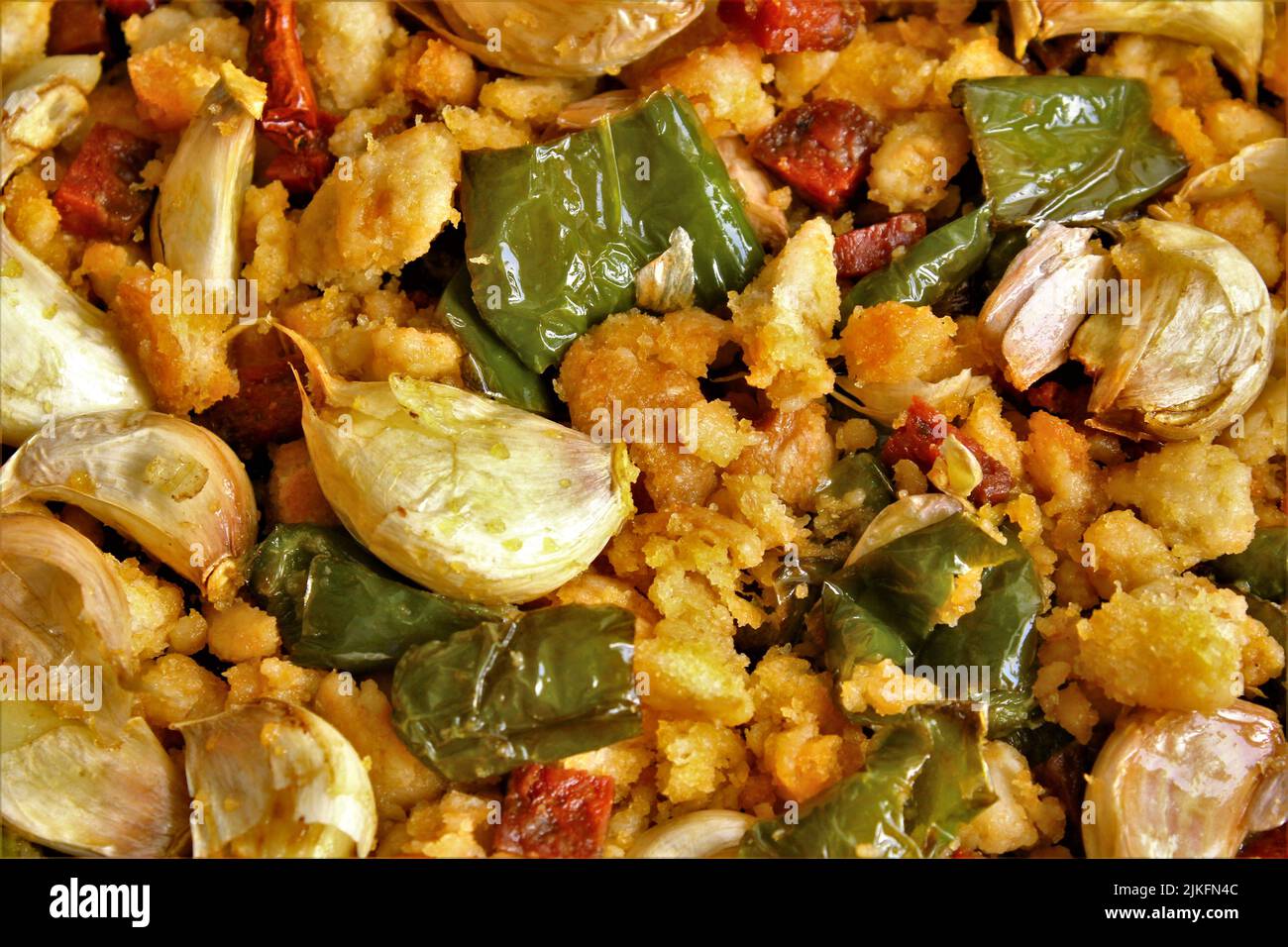 Top view close up cooked migas Spanish traditional food. photo full ...