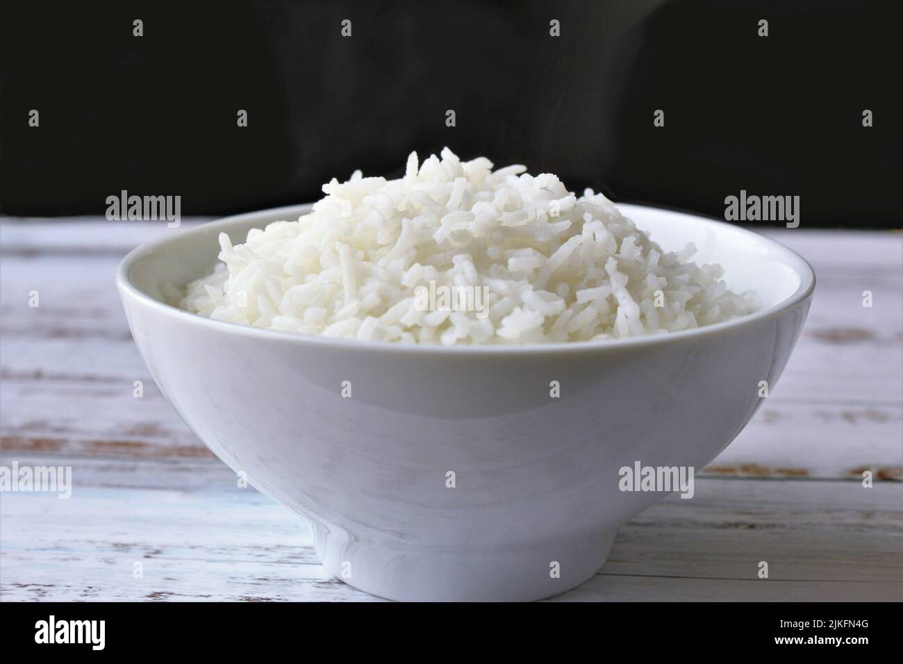 The bowl of cooked white rice photo front view Stock Photo - Alamy
