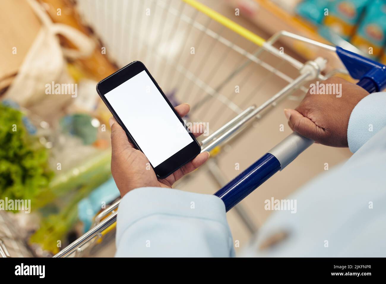 Close up of unrecognizable black woman buying groceries in supermarket ...