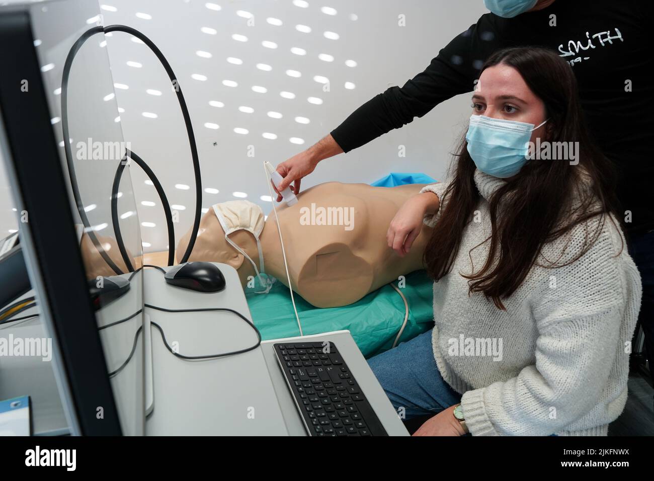 Students and their teacher during an echography simulation workshop on ...