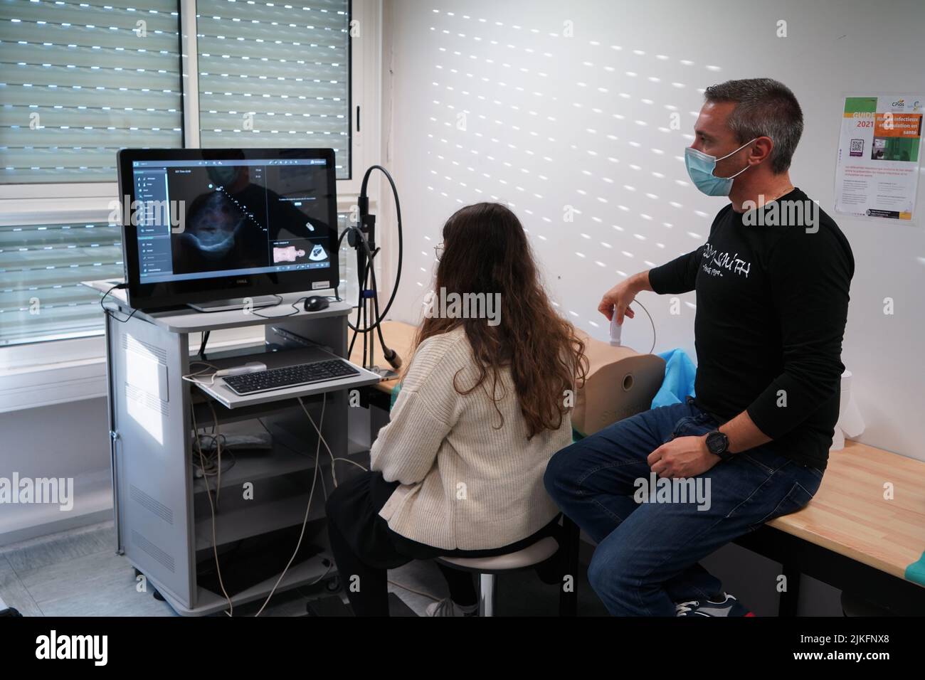 Students and their teacher during an echography simulation workshop on ...