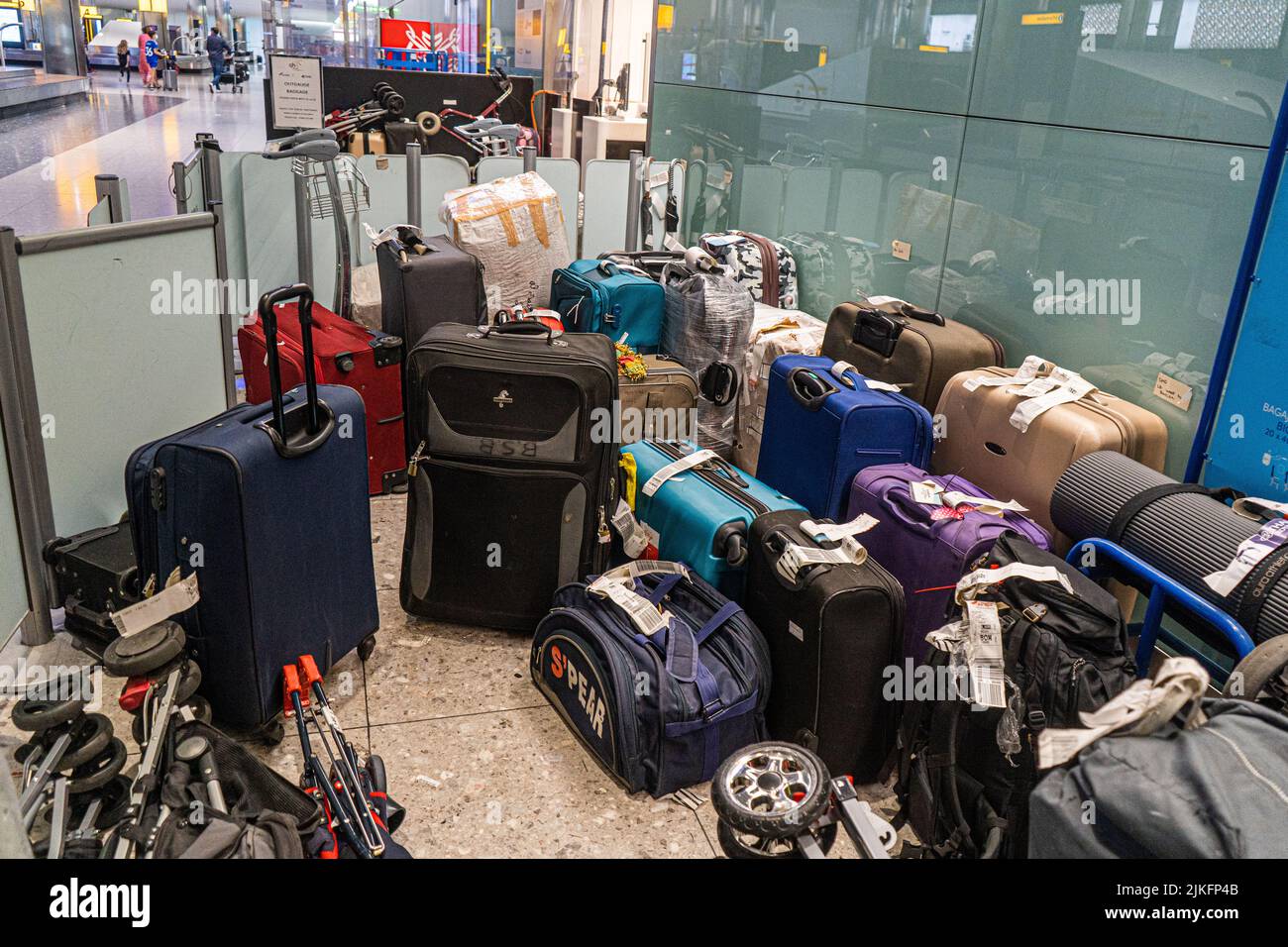 Heathrow , London, UK 2 August 2022. Uncollected luggage in the baggage ...