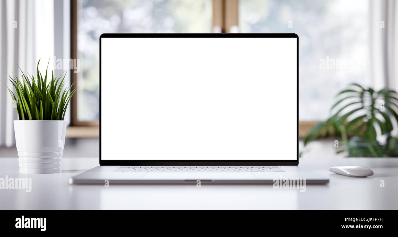 Laptop with blank screen on table in bright livingroom - home office ...