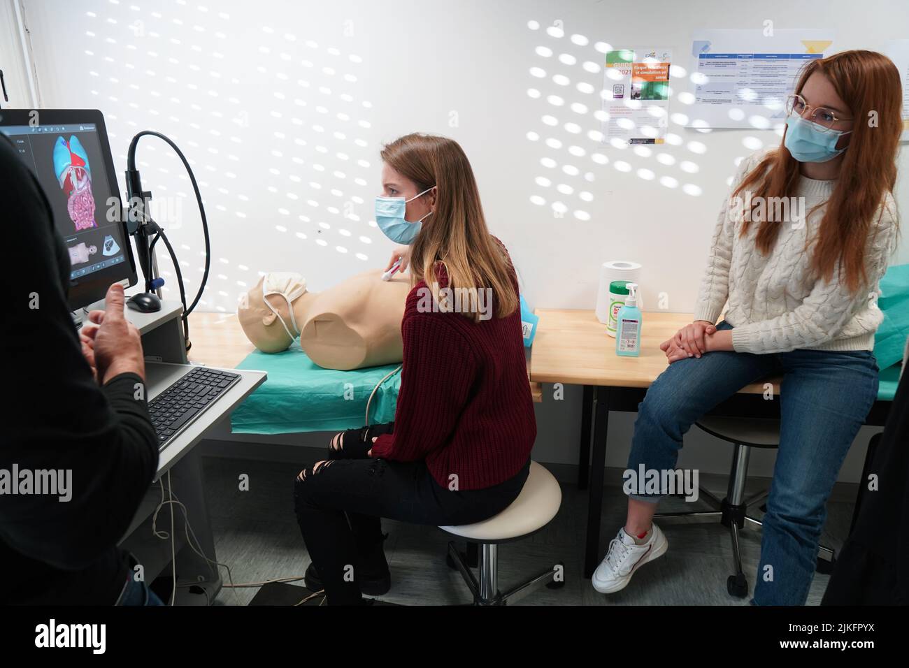 Students and their teacher during an echography simulation workshop on ...