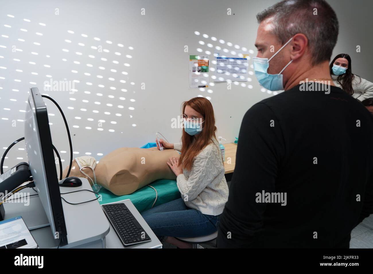 Students and their teacher during an echography simulation workshop on ...