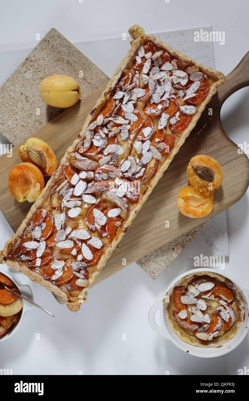 Homemade rectangular shortbread pie with apricots and peaches. White ...