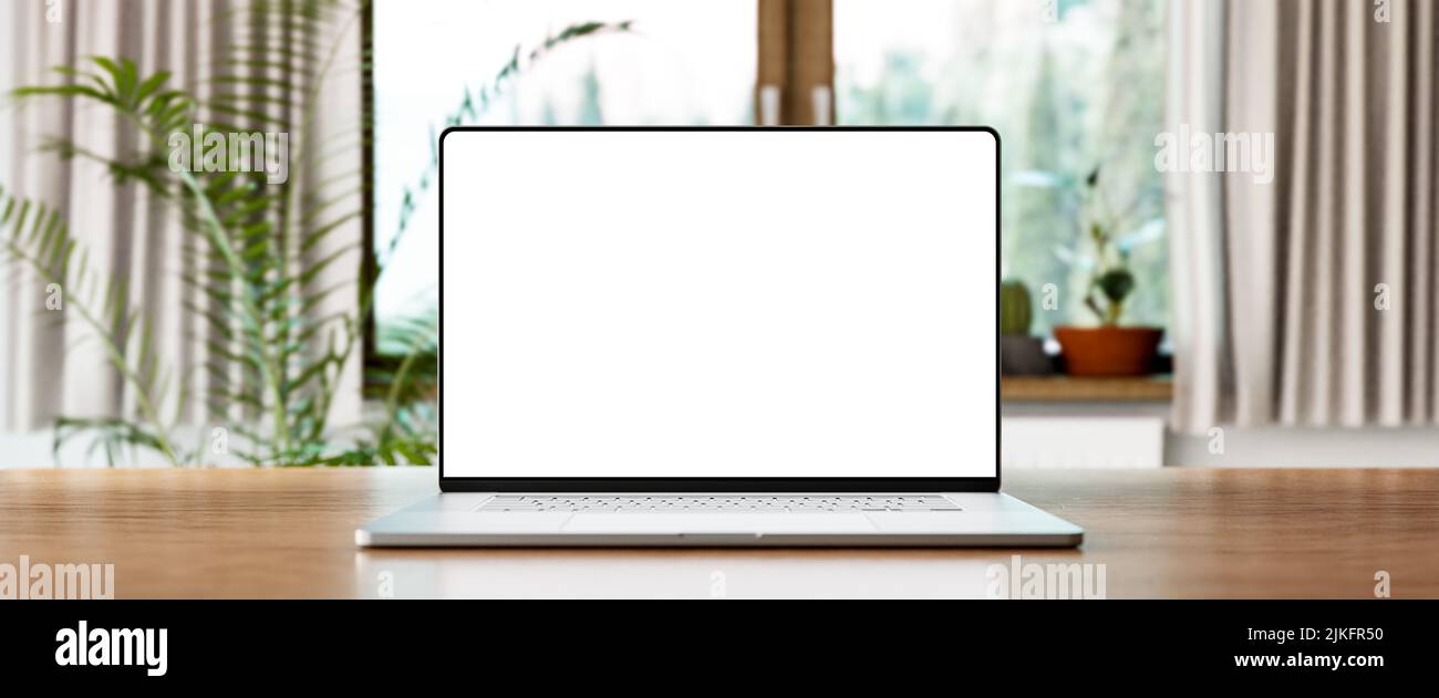 Laptop with a blank frameless screen on the table - panoramic shot - 3d ...