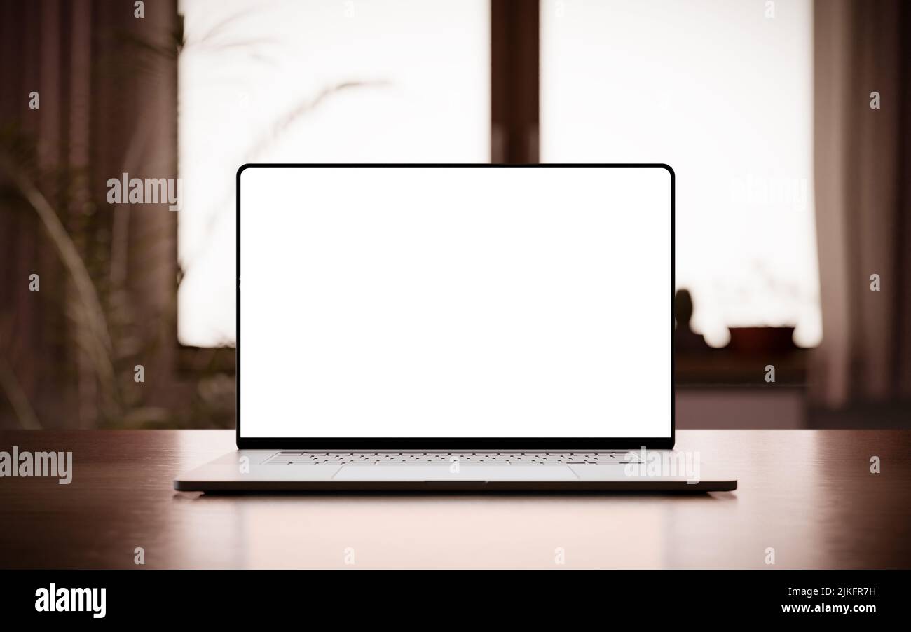 Laptop with frameless blank screen on the table in the home interior ...