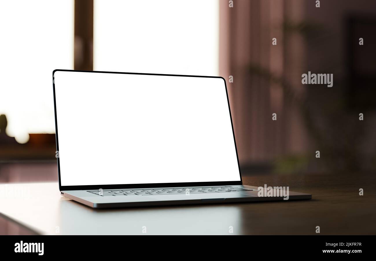 Laptop with frameless blank screen on the table in the home interior ...