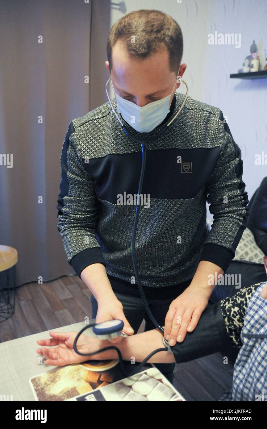 Male nurse measuring patients blood hi-res stock photography and images ...