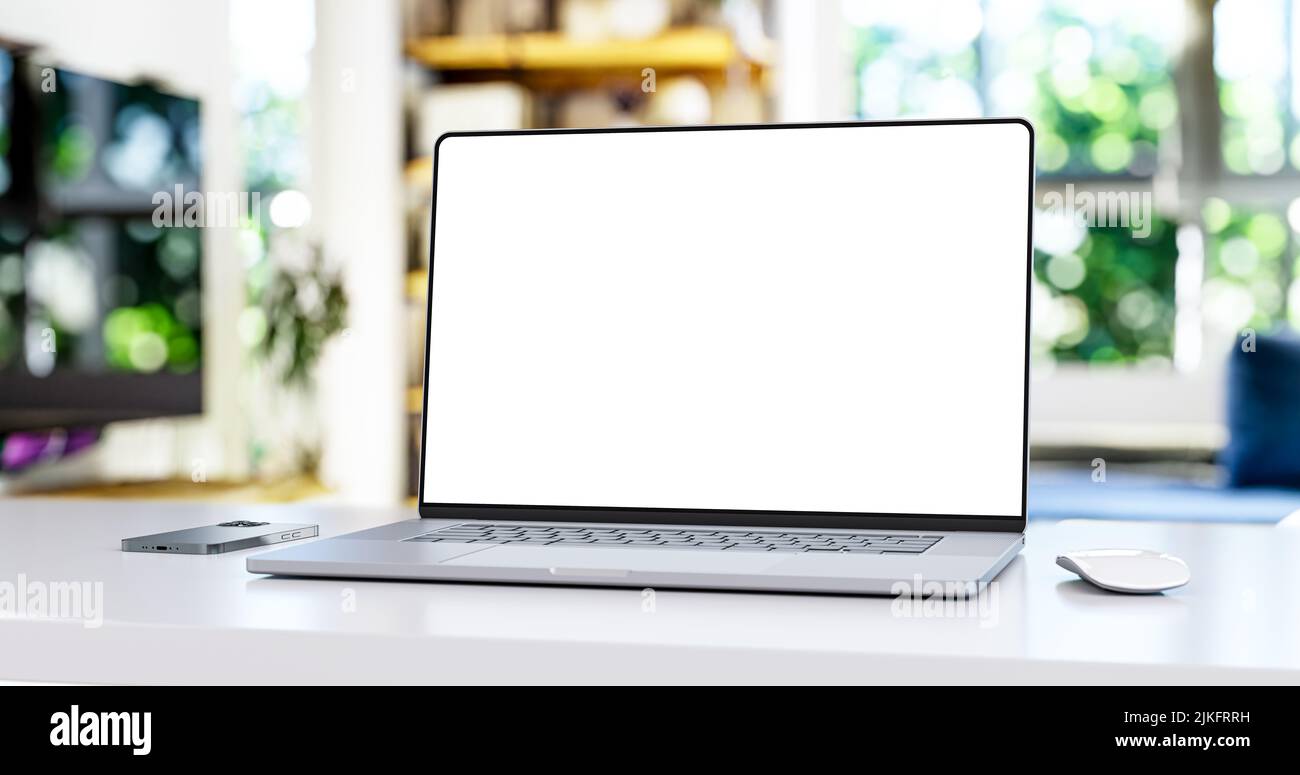 Laptop with frameless blank screen on table in home interior Stock ...