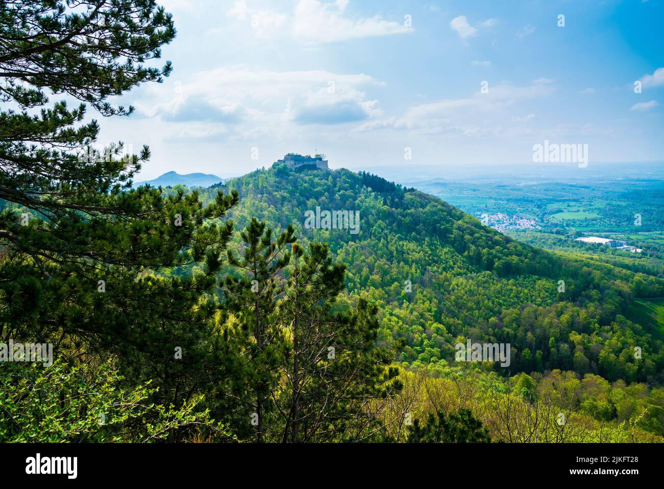 Germany, Hohenneuffen castle ruins on top of forested mountain peak in ...