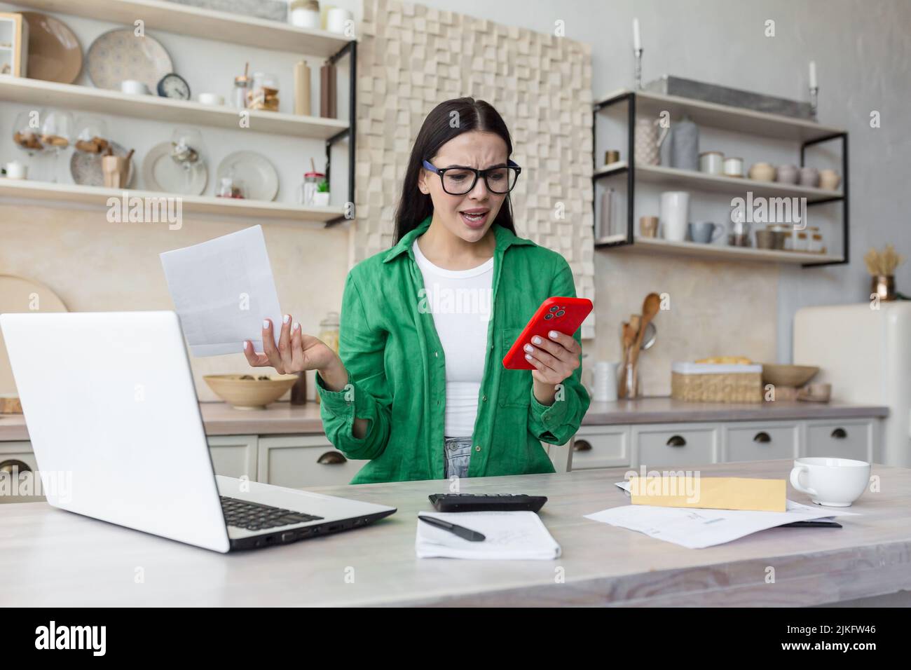 disappointed woman at home with paper work, brunette in kitchen ...