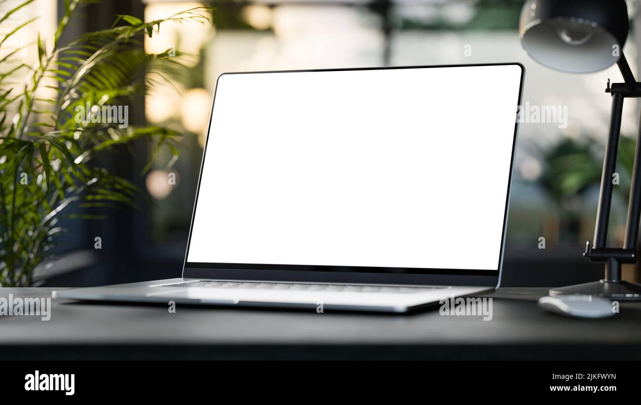 Laptop with blank frameless screen mockup template on the table in ...