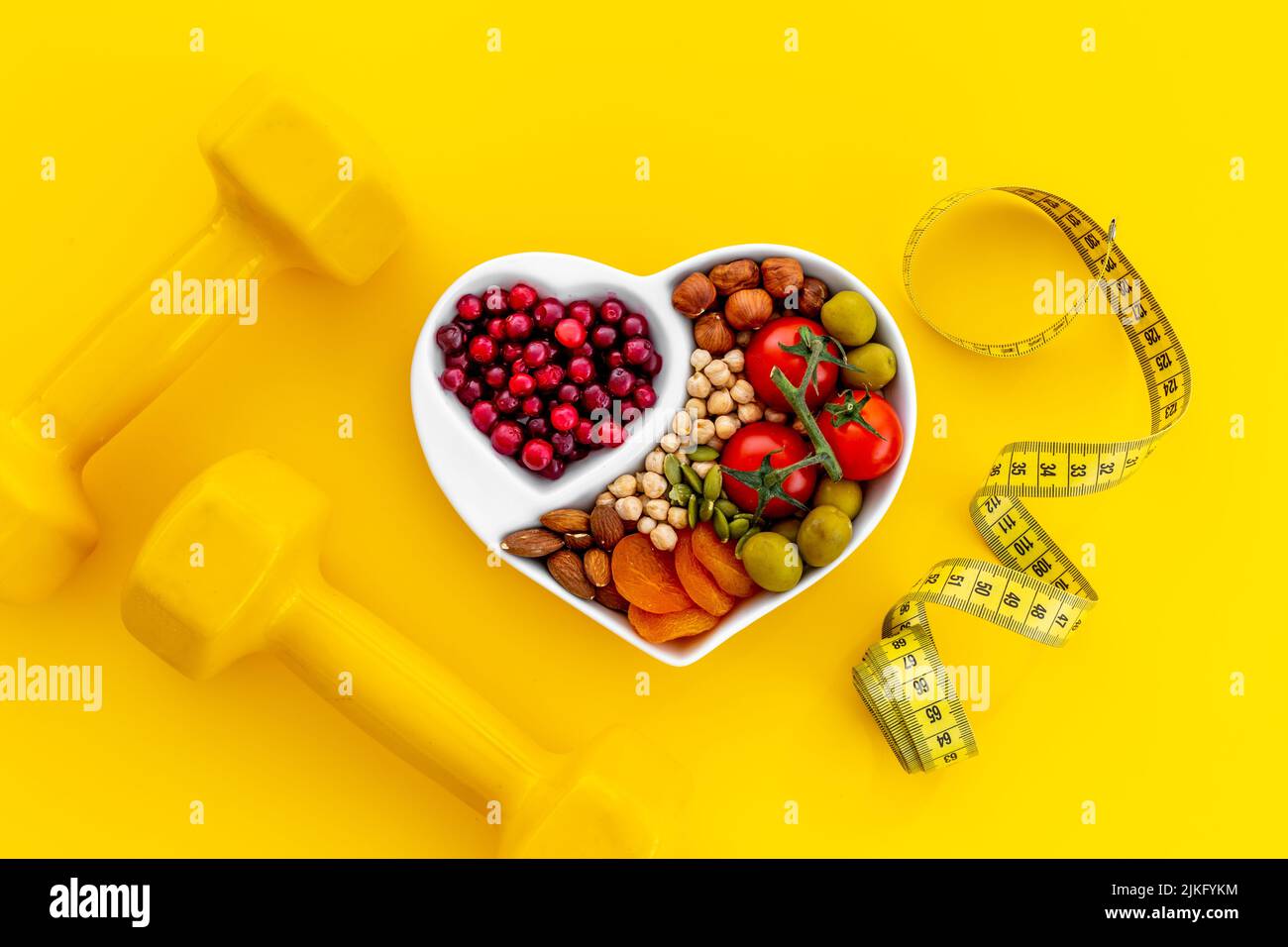 Healthy food in heart shaped dish. Healthy lifestyle and nutrition ...