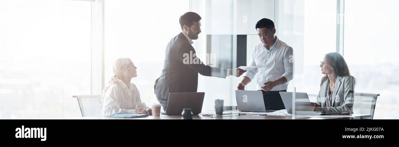 Creative business people working on new project in modern office with ...