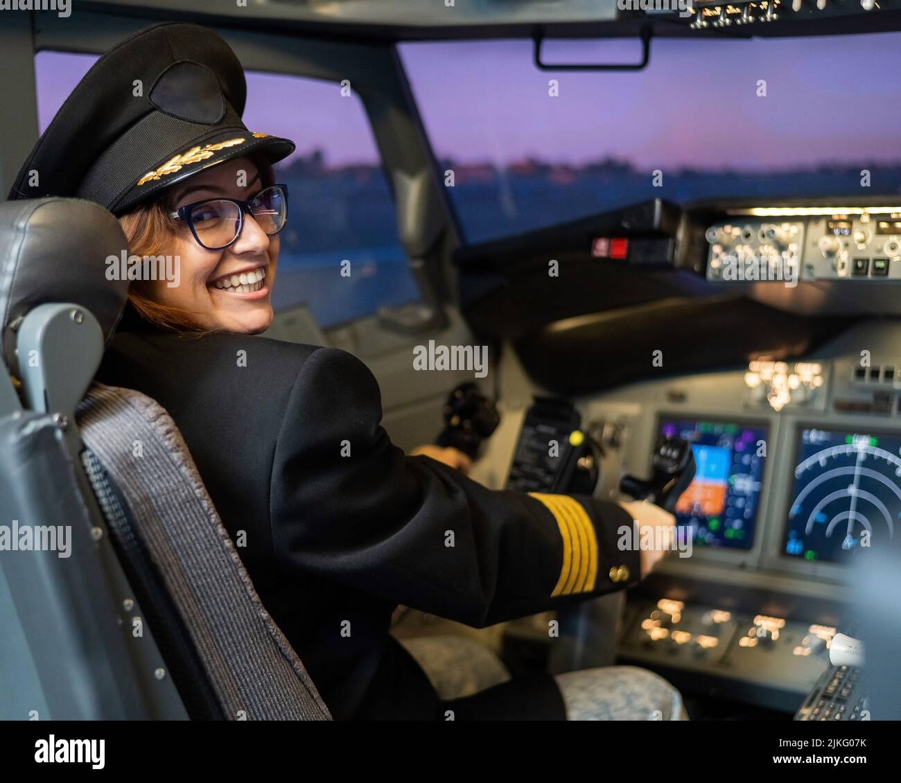 Female airline pilot in cockpit hi-res stock photography and images - Alamy