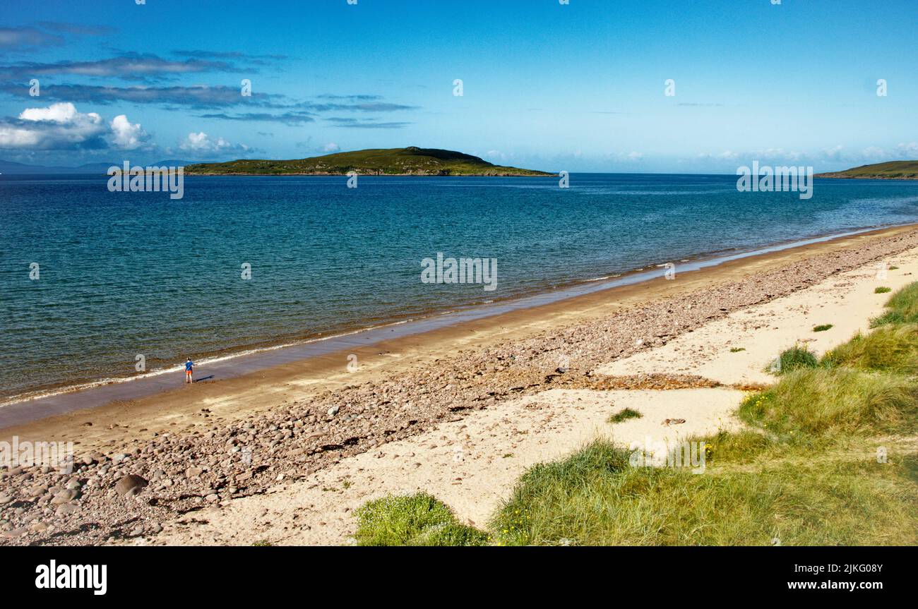 BIG SAND BEACH GAIRLOCH SCOTLAND LONE BEACHCOMBER ON THE SANDY BEACH IN ...