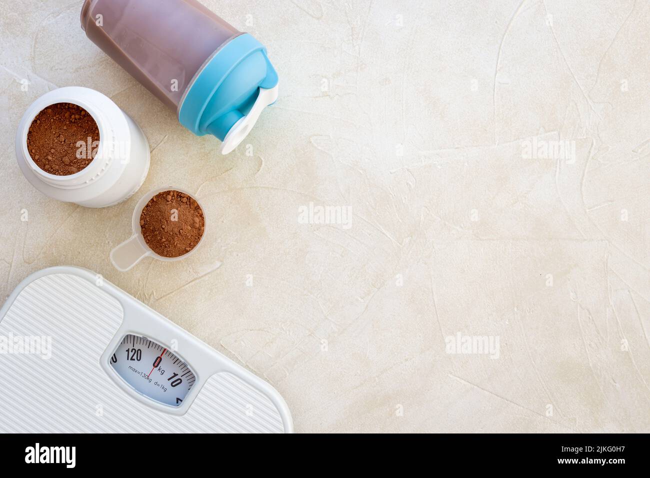 Sport diet food - whey protein in jar and scales. Fitness and gym ...