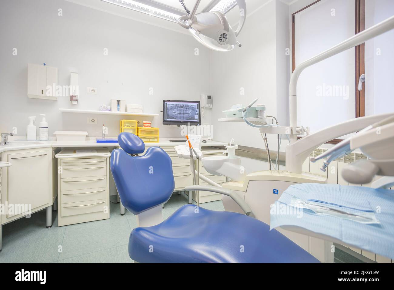 Interior shot of a dentist studio with a professional dentist chair, no ...