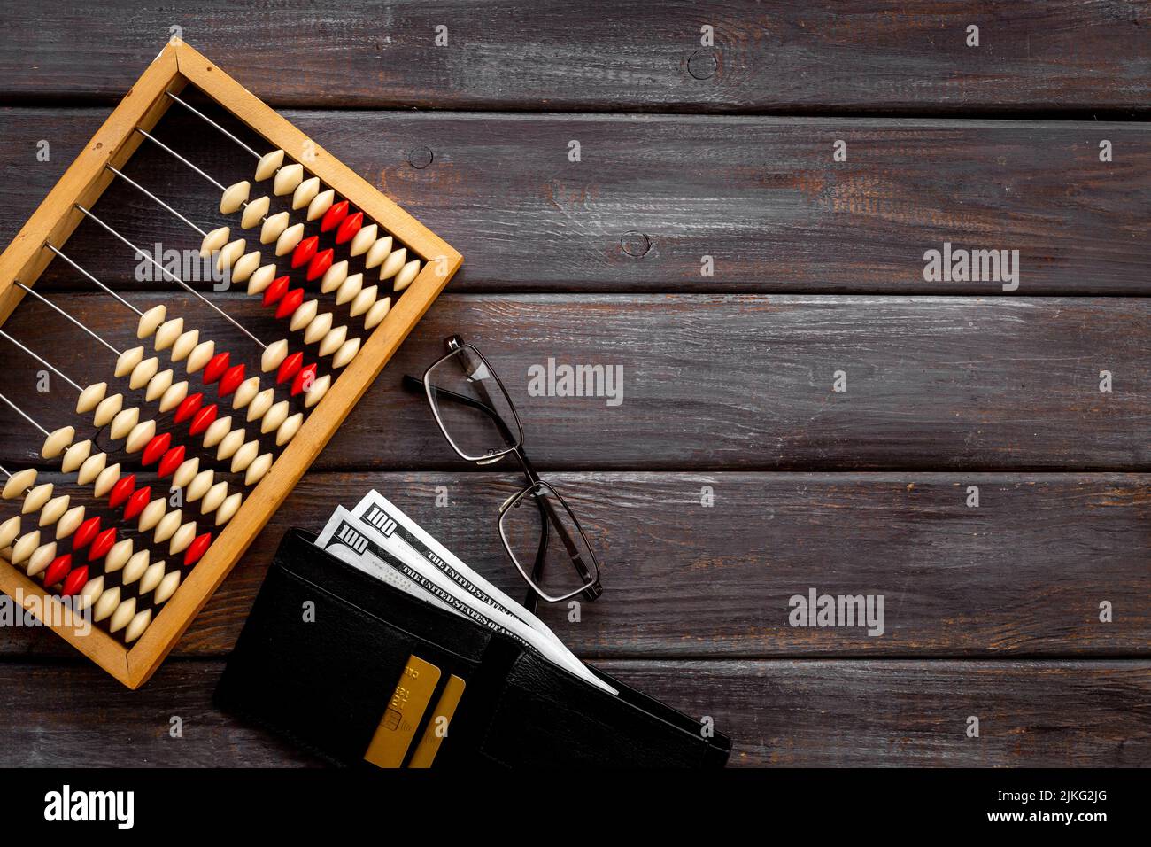 Vintage accounting wooden abacus with wallet. Personal finance concept ...