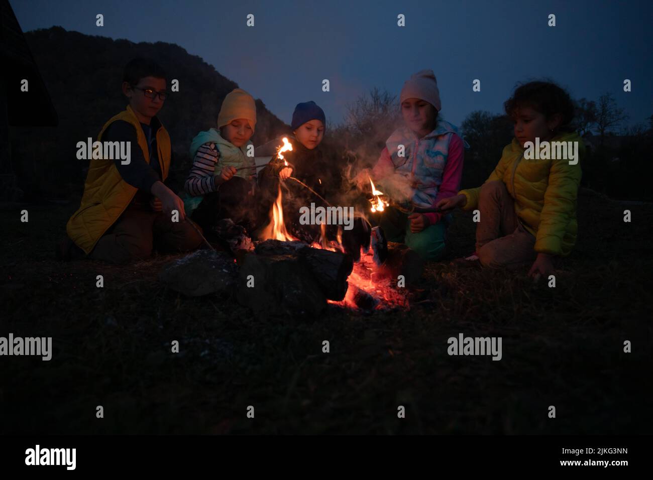 Children in the camp by the fire Stock Photo - Alamy