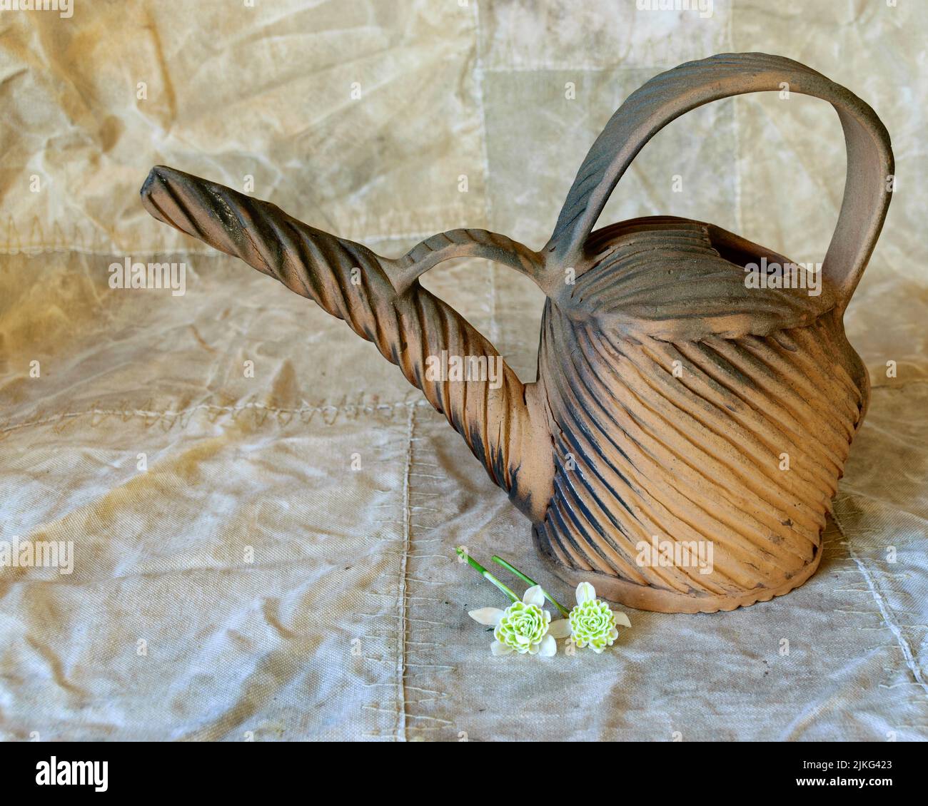 decorative clay mug, crumpled fabric background, handmade, still life ...