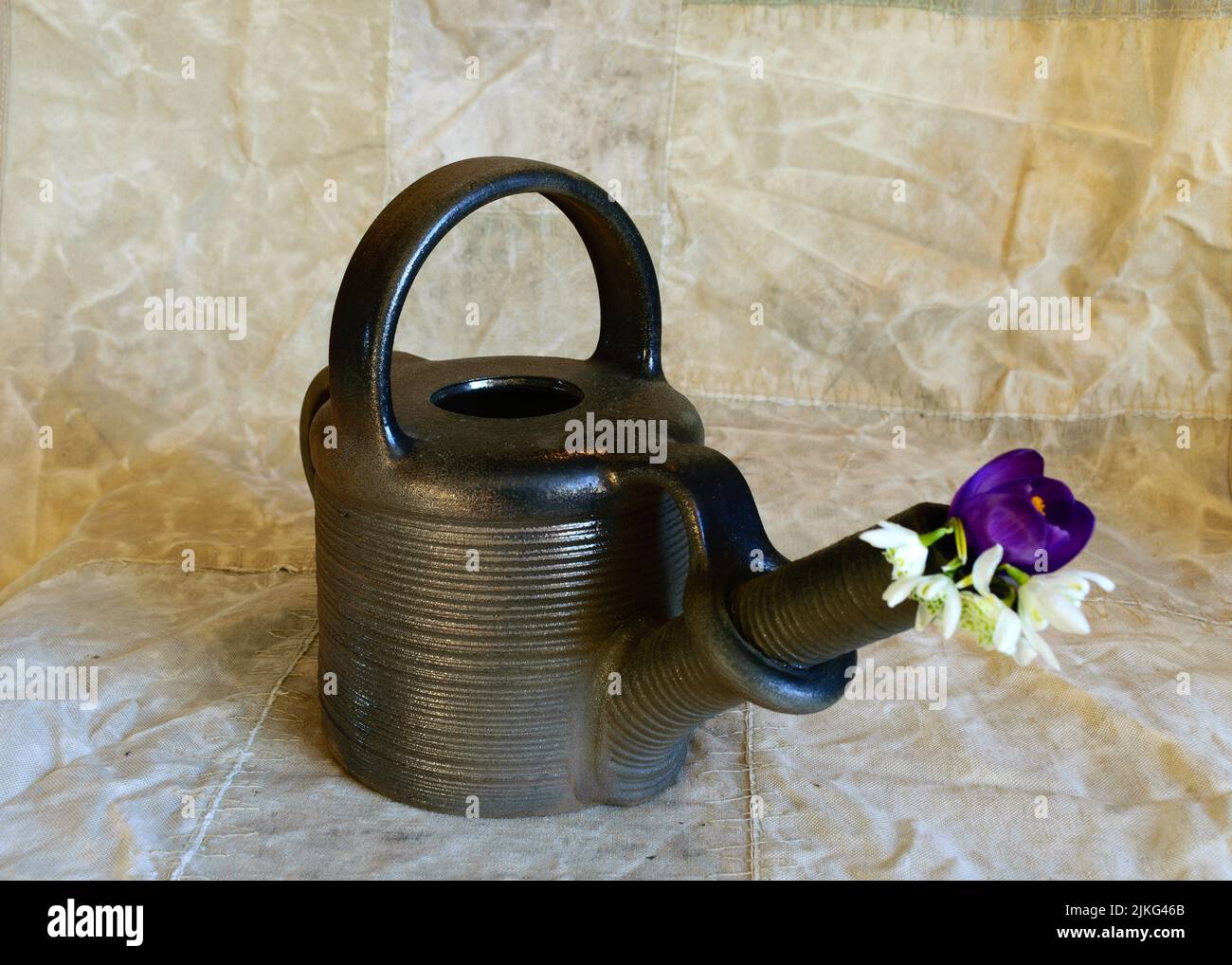 decorative clay mug, crumpled fabric background, handmade, still life ...