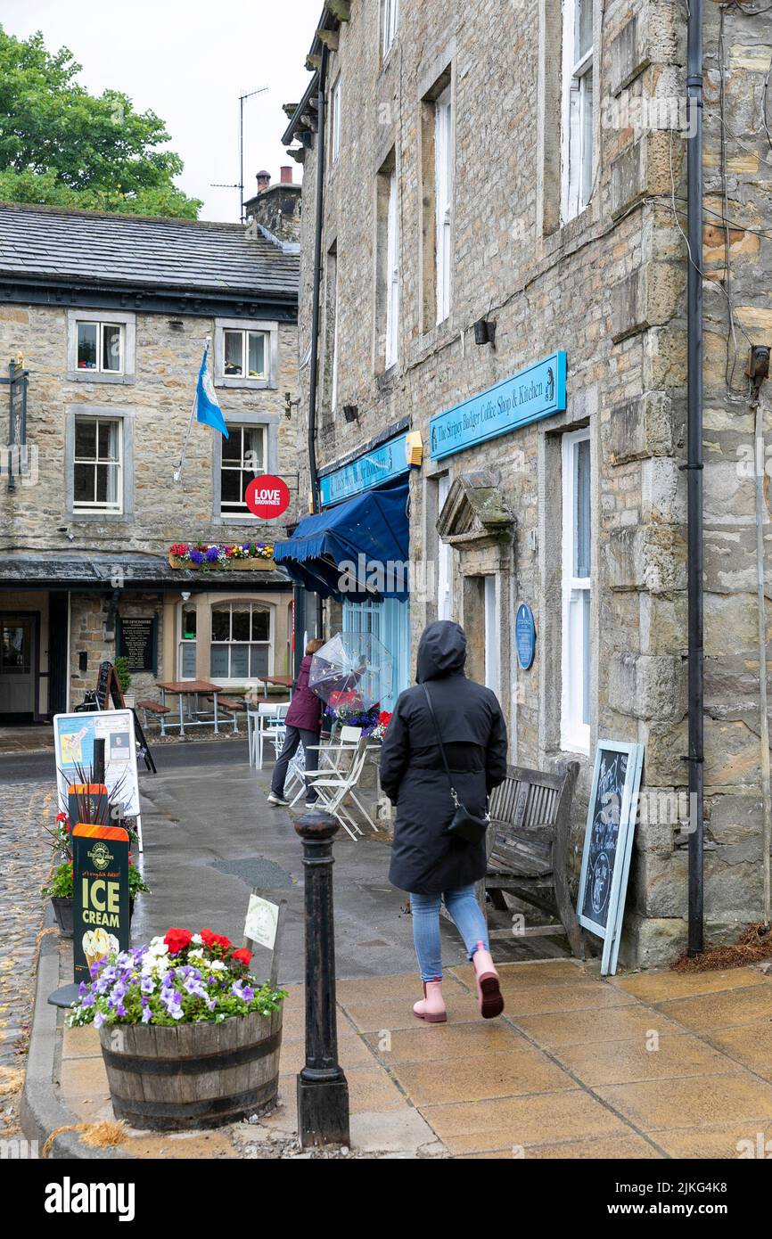 Grassington village in the Yorkshire Dales, model released woman walks ...