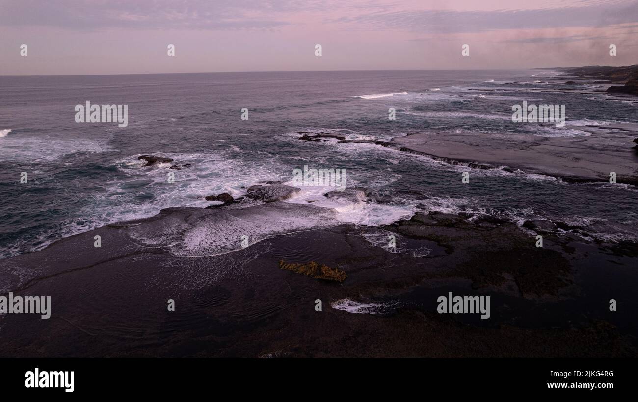 Waves roll in, beautiful rye beach,victoria, australia. commonly a very ...