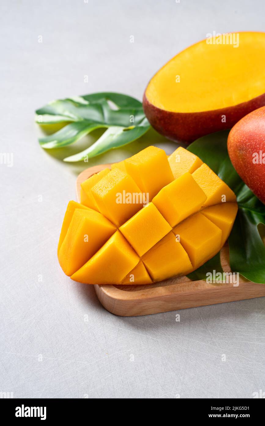 Mango background design concept. Top view of diced fresh mango fruit ...