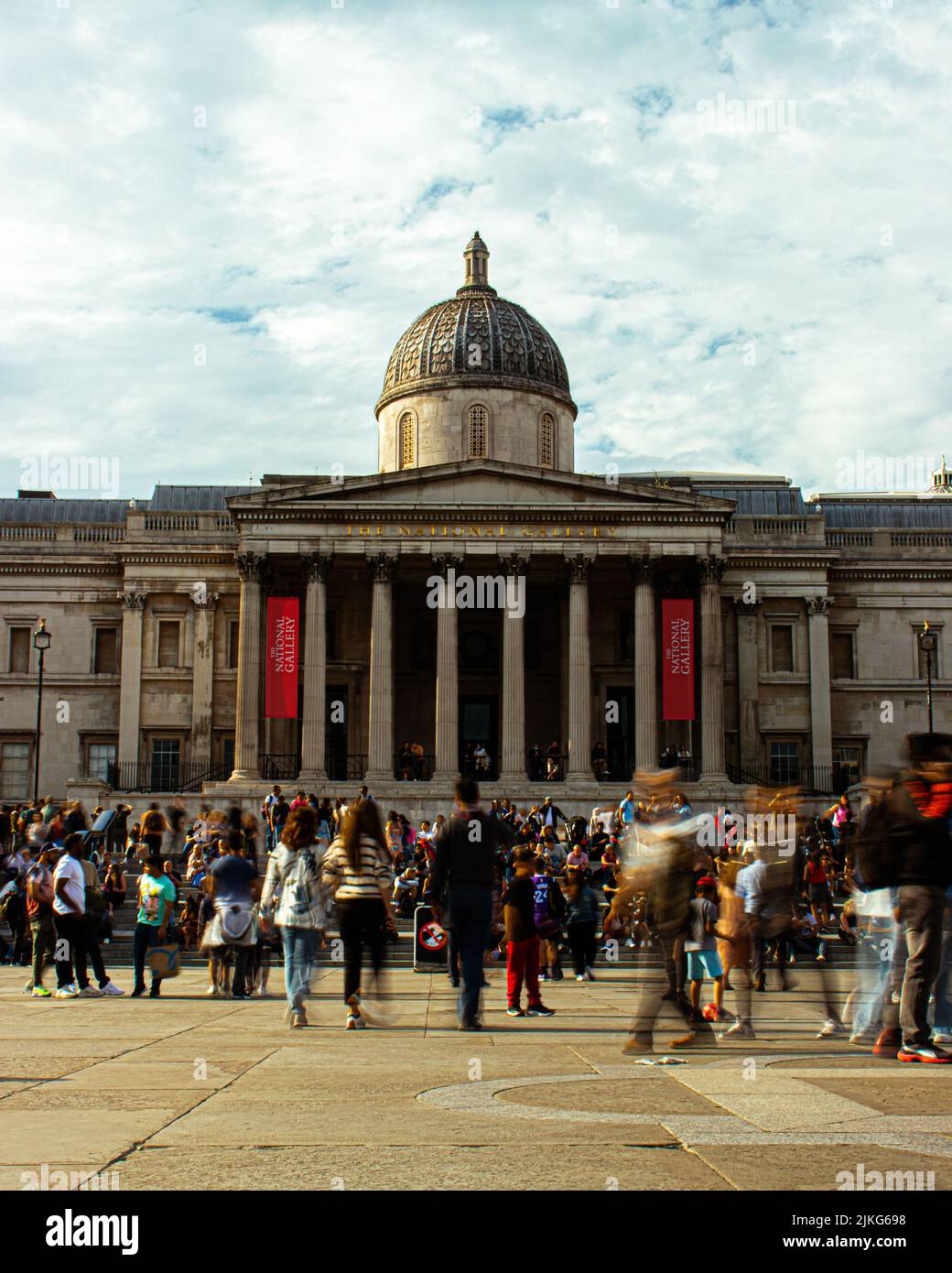 A vertical shot of the National Gallery with the crowded Trafalgar ...