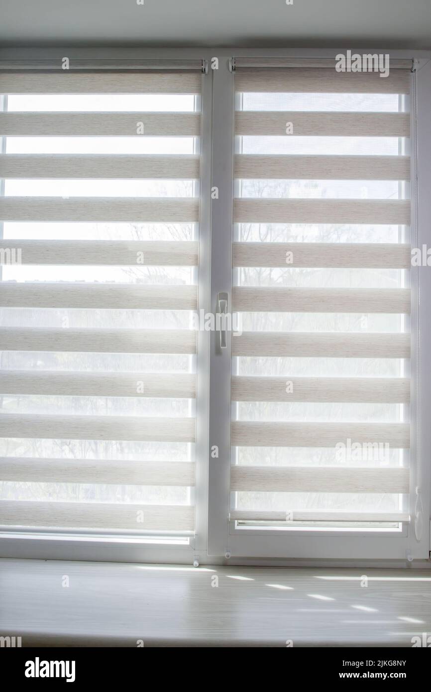 Window roller duo system day and night. Close up on roll curtains ...