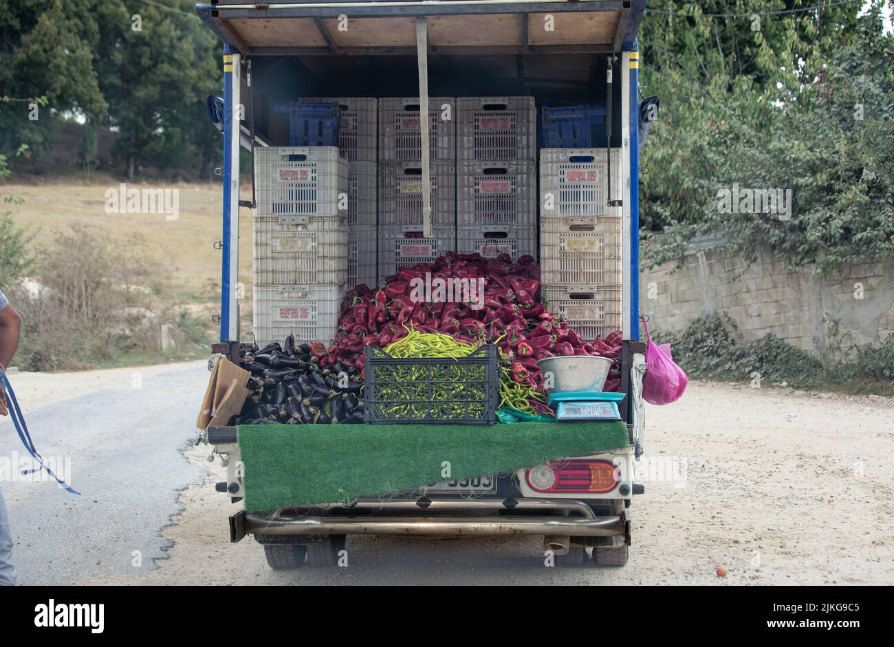 Street vegetable seller truck full of capia and green peppers ...