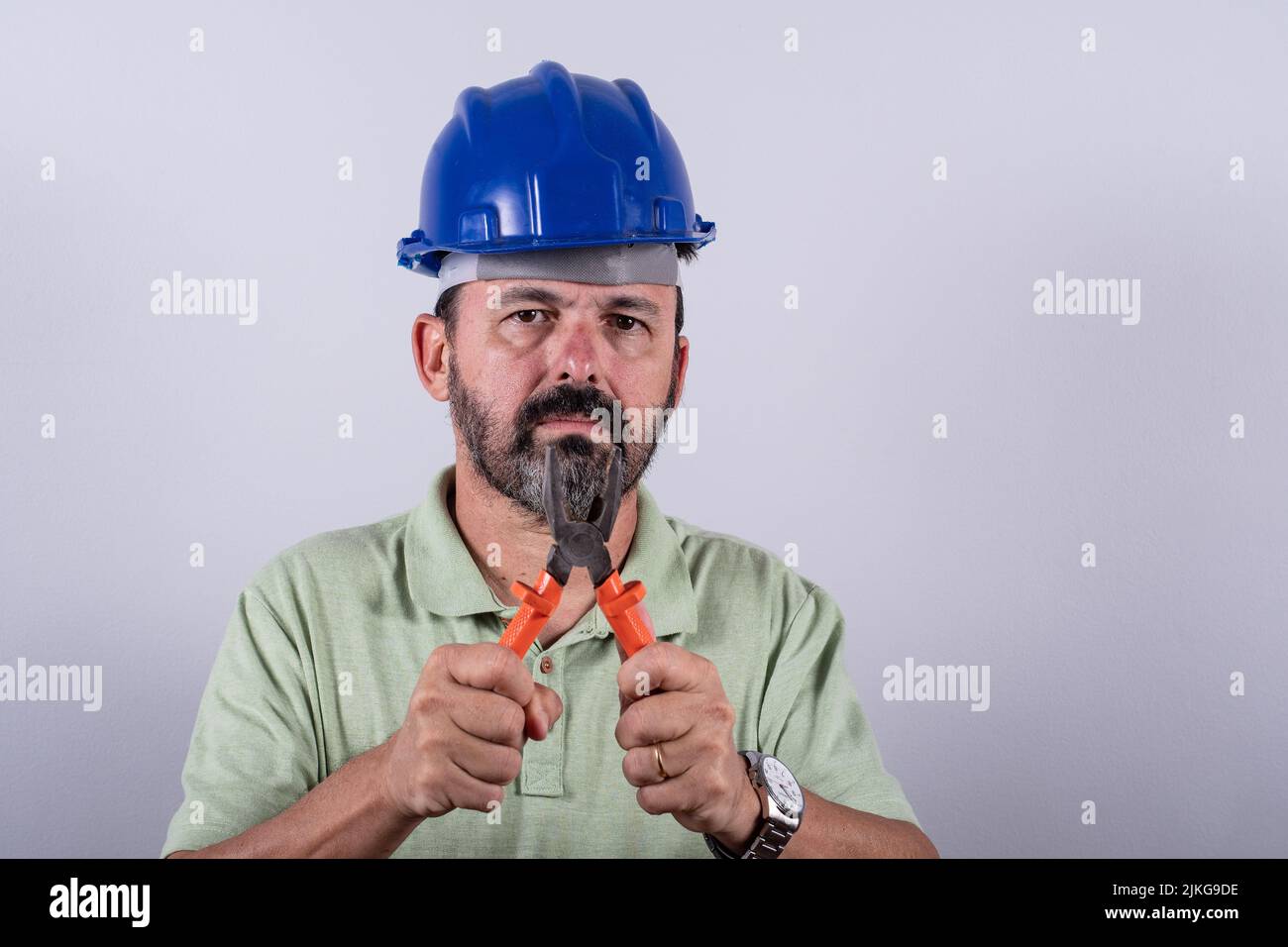 Portrait of 60 years old professional heavy industry engineer/worker ...