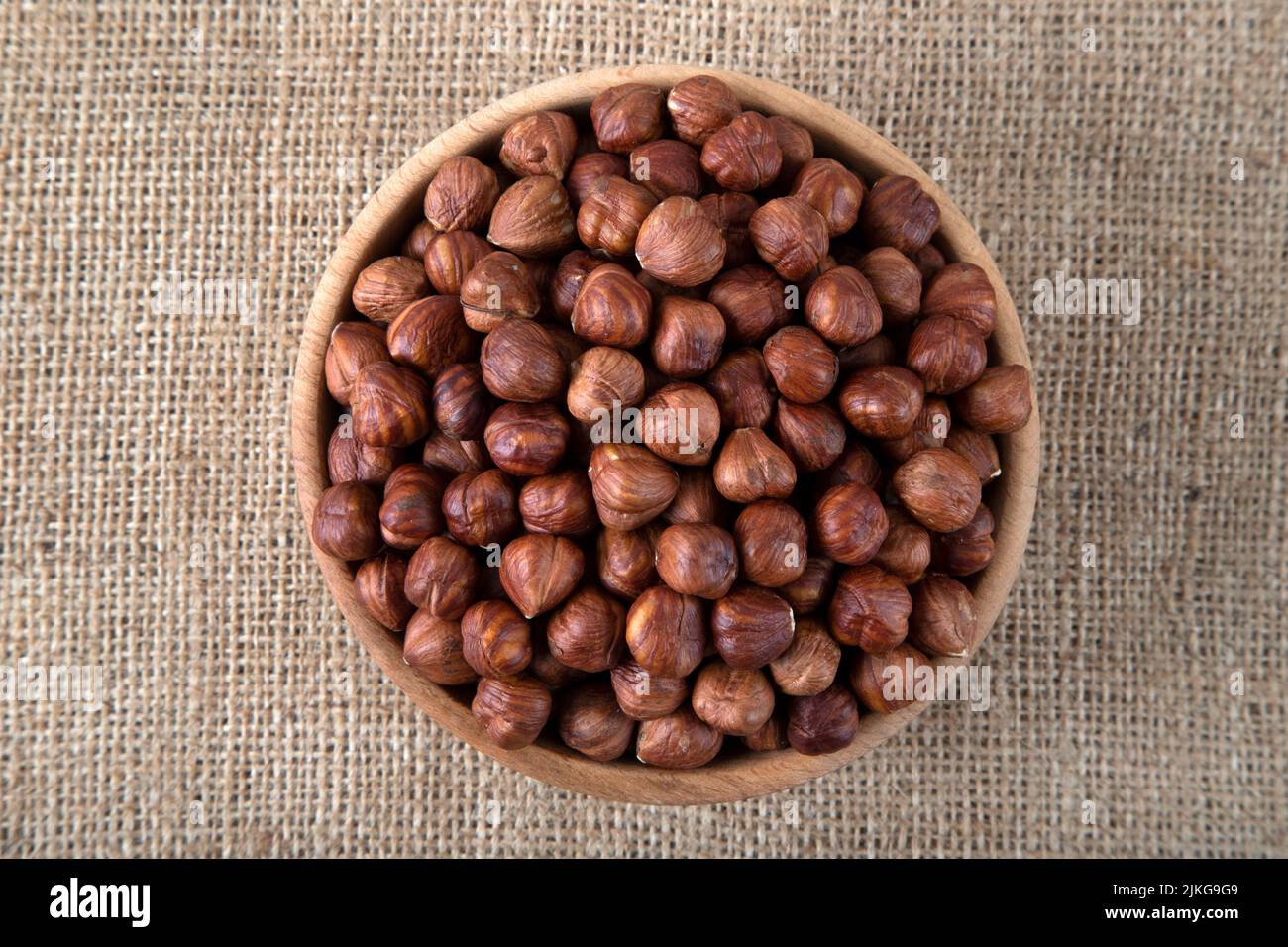 Top view of a bowl full of hazelnuts Stock Photo - Alamy