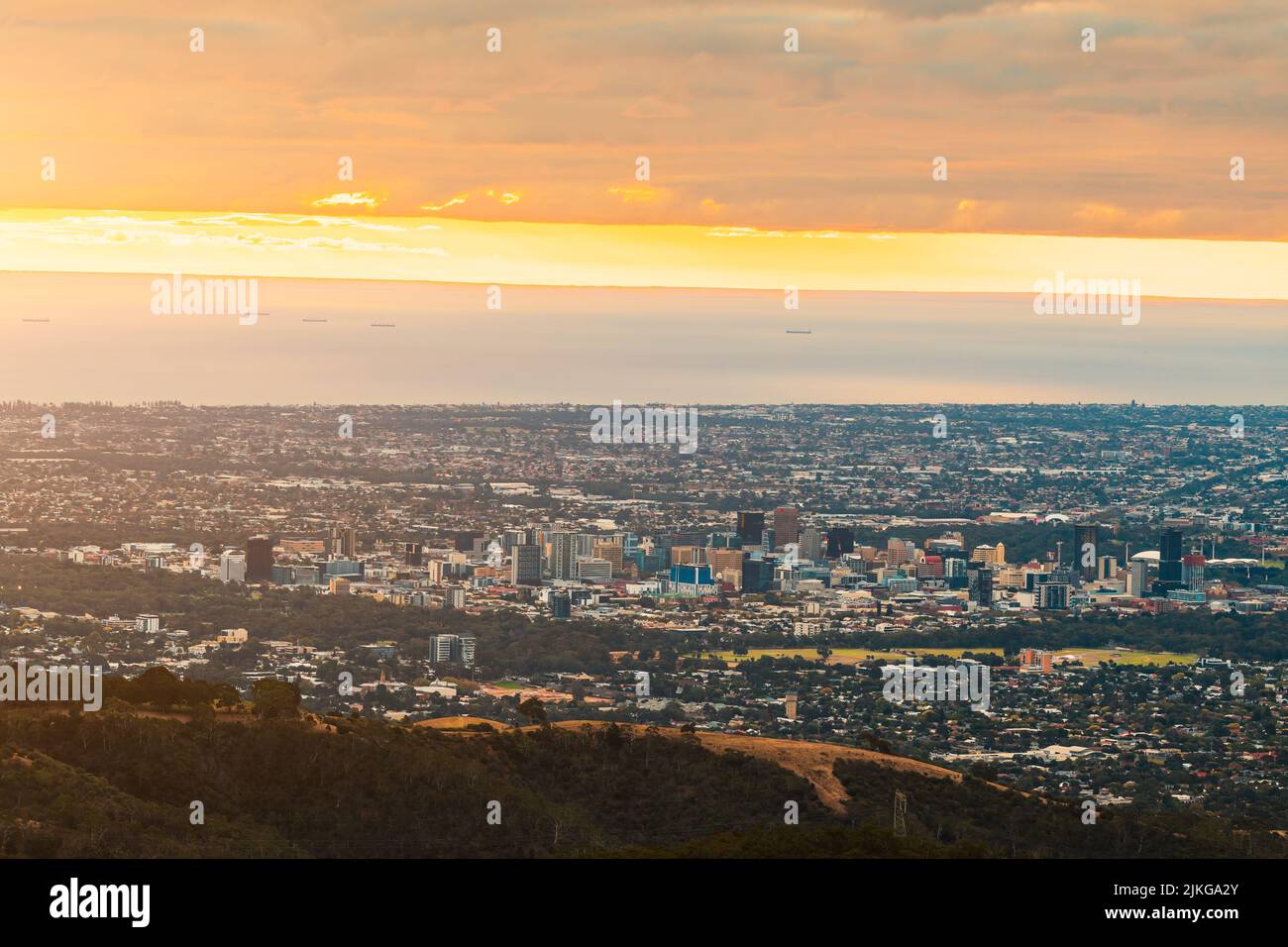 Adelaide city skyline at sunset viewed from the hills, South Australia ...