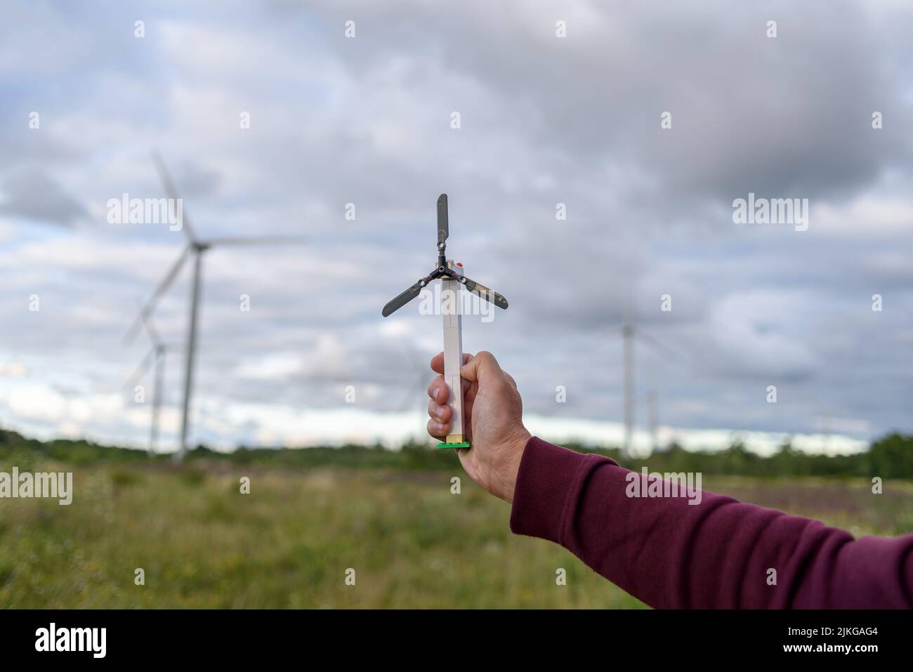 Toy Wind power turbine made from children building kit blocks holding ...