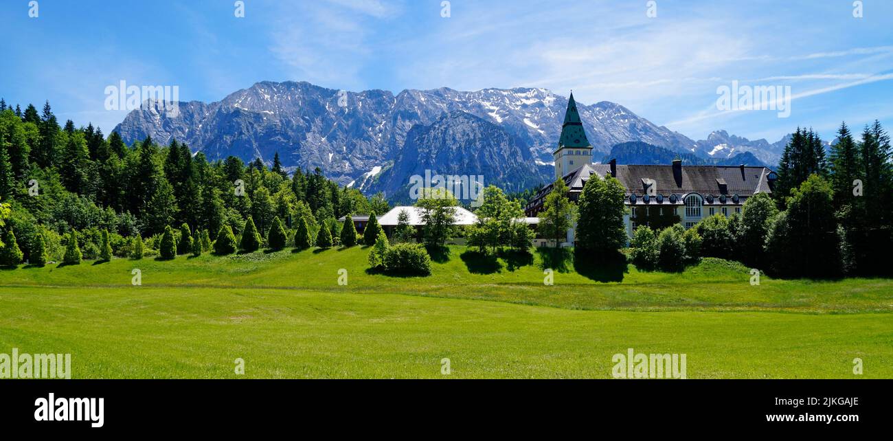a scenic view of the Elmau Schloss Hotel in the german Alps (Germany ...