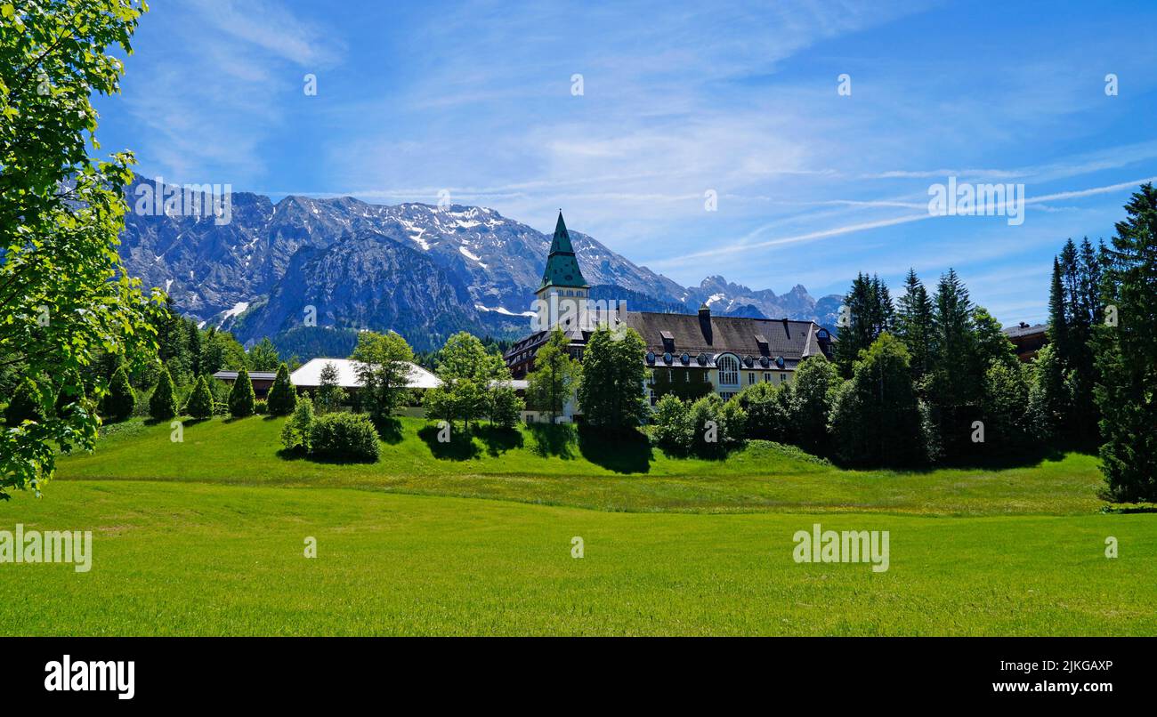 a scenic view of the Elmau Schloss Hotel in the german Alps (Germany ...