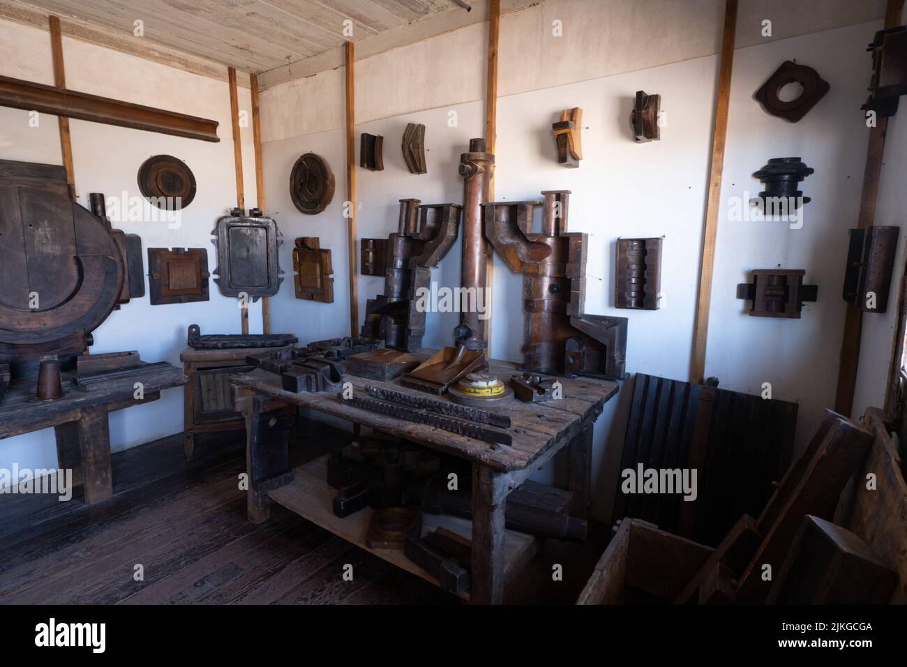 Museum display of wooden forms used for molds for casting bronze parts ...