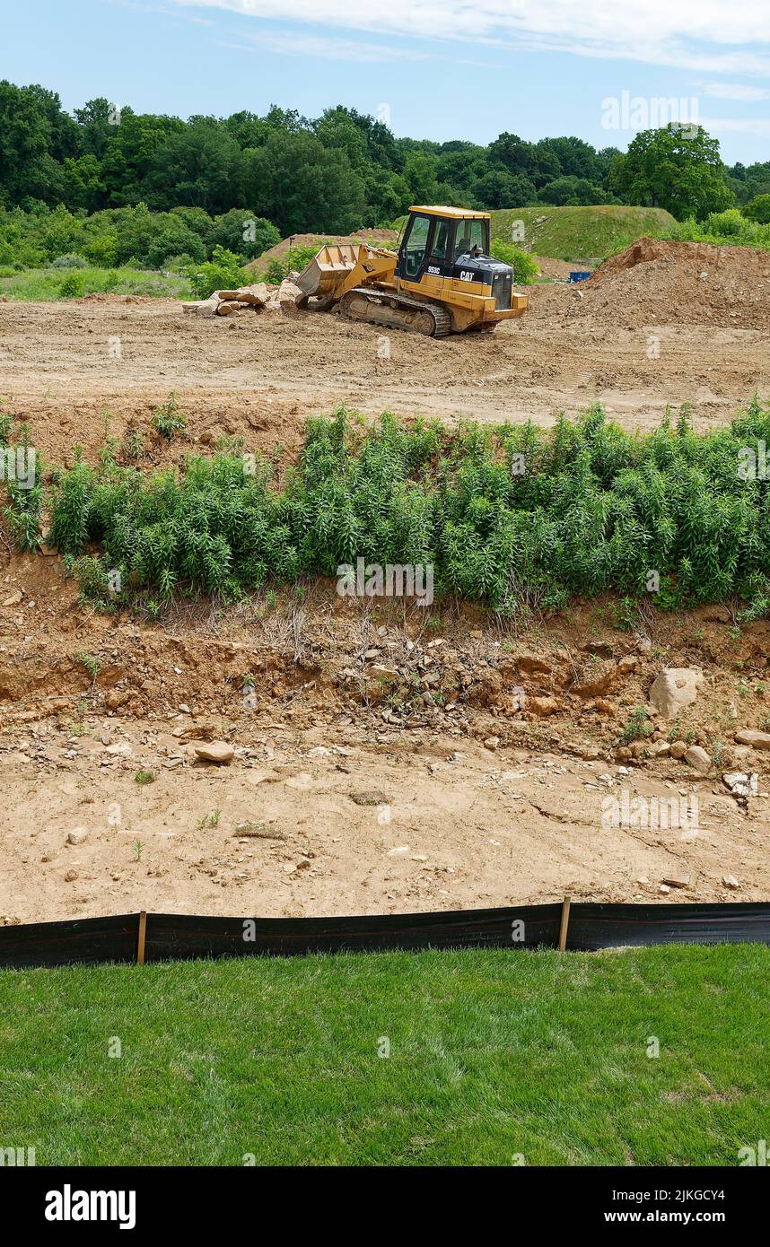 new house construction; bulldozer, moved rocks, heavy equipment, dirt ...