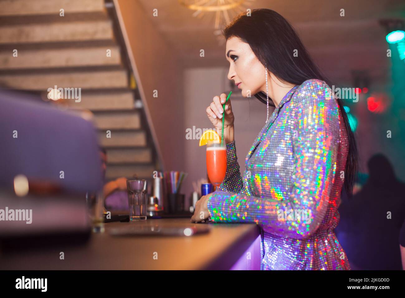 Woman with cocktail drink in the bar Stock Photo - Alamy