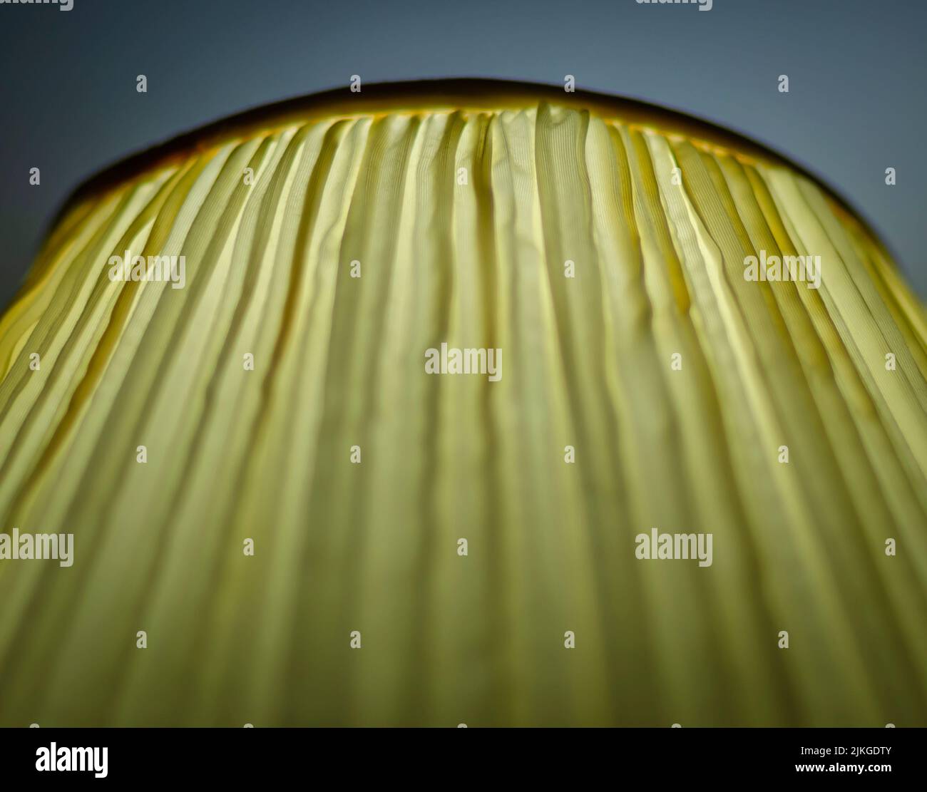 A close up of the fabric of a glowing lampshade Stock Photo - Alamy