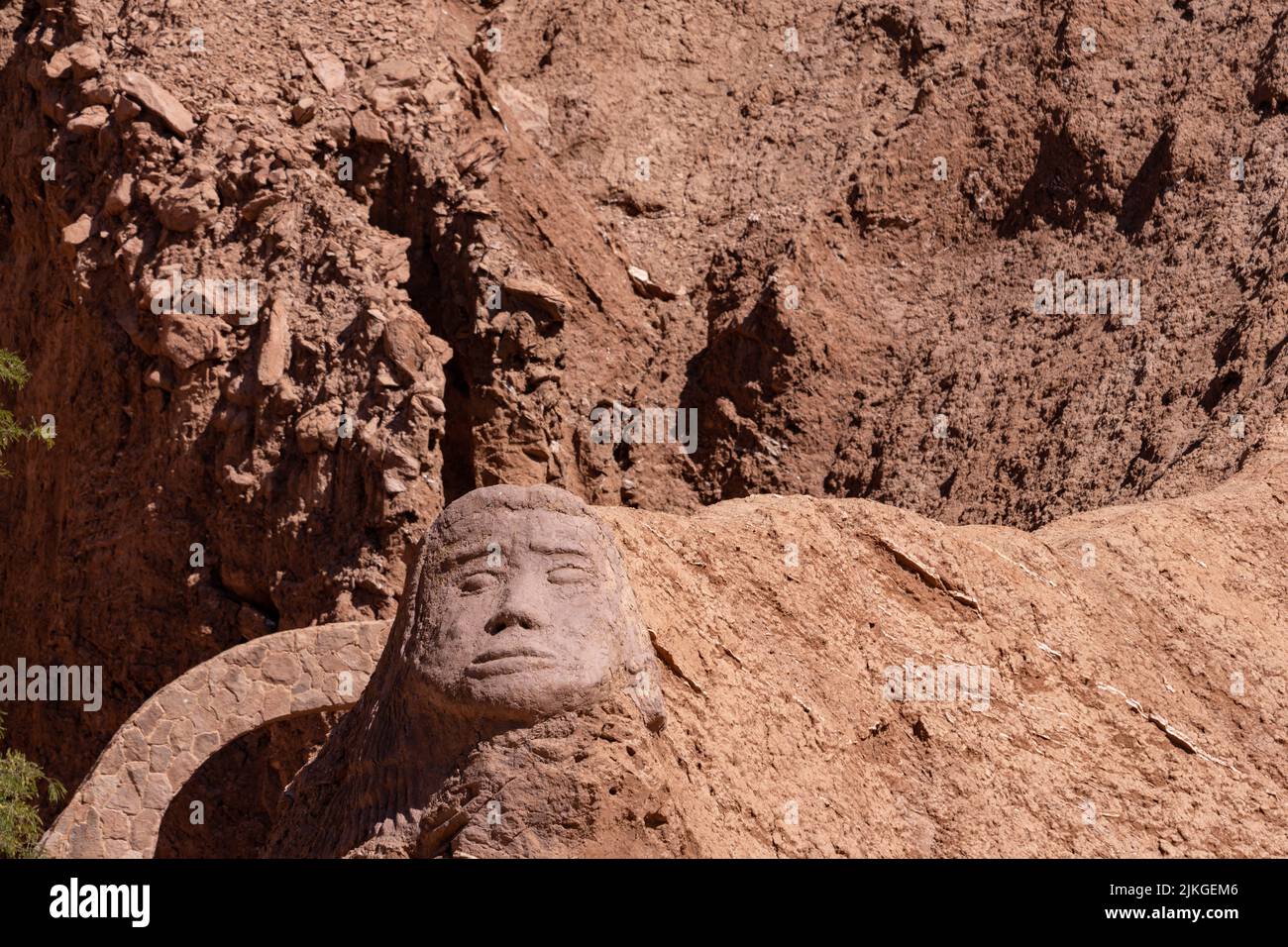 A sculpted face at Pukata de Quitor, the archeological site of an Inca ...