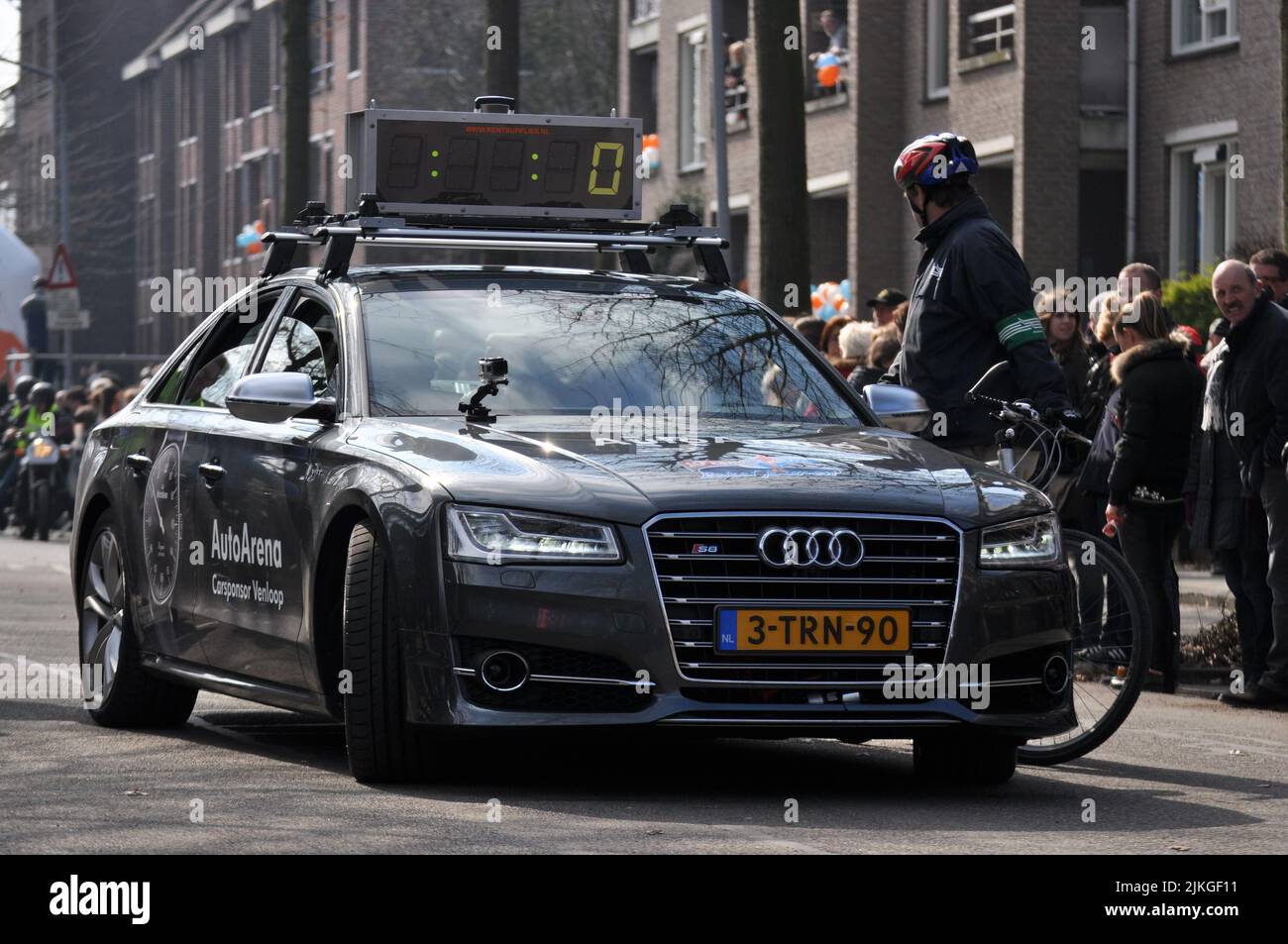 The grey Audi S8 Pace Car with a screen on the roof on the street Stock ...