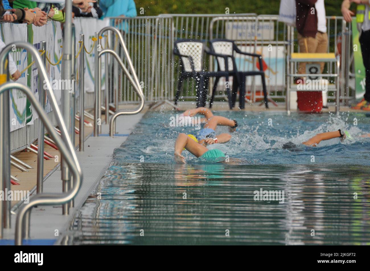 The athletes swimming in the pool during the competition Stock Photo ...
