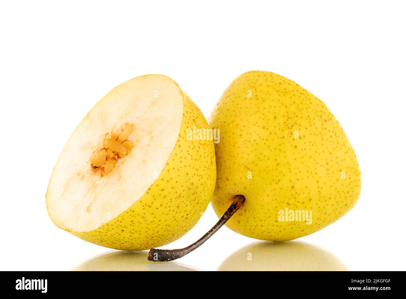 Two halves of a juicy yellow pear, close-up, isolated on a white ...