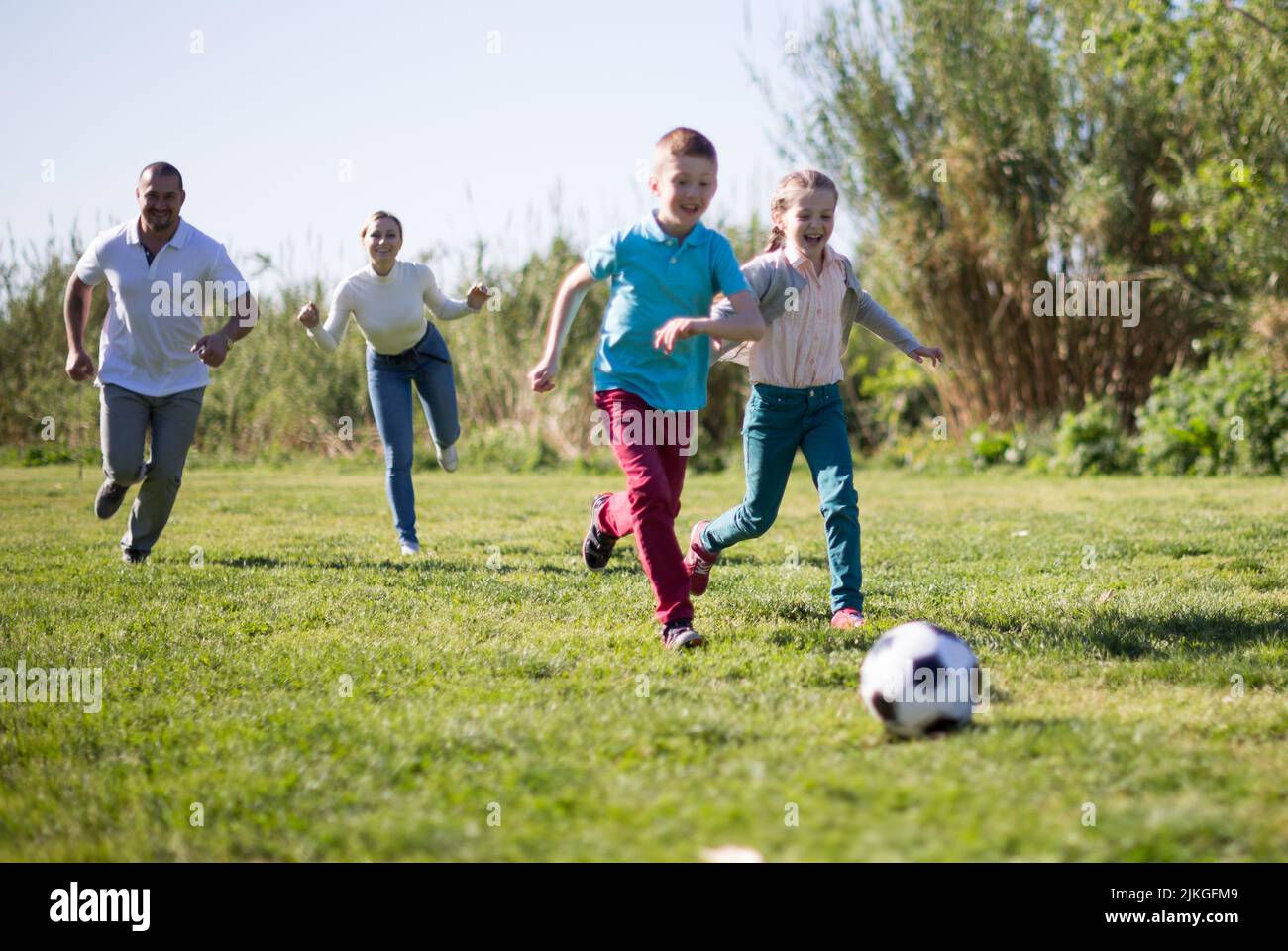 children playing soccer on the field Stock Photo - Alamy