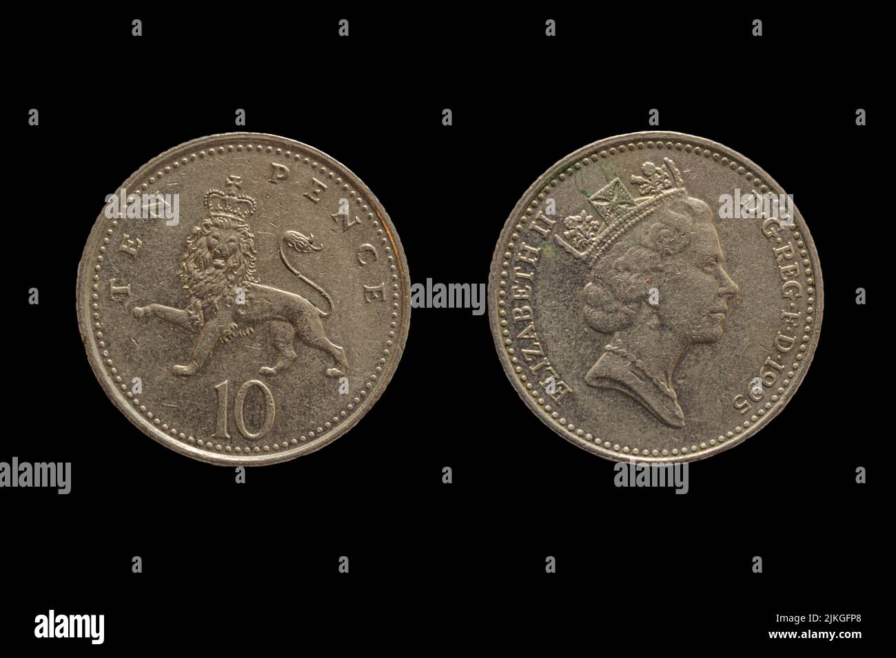 A top view closeup of British coins obverse and reverse on a black ...